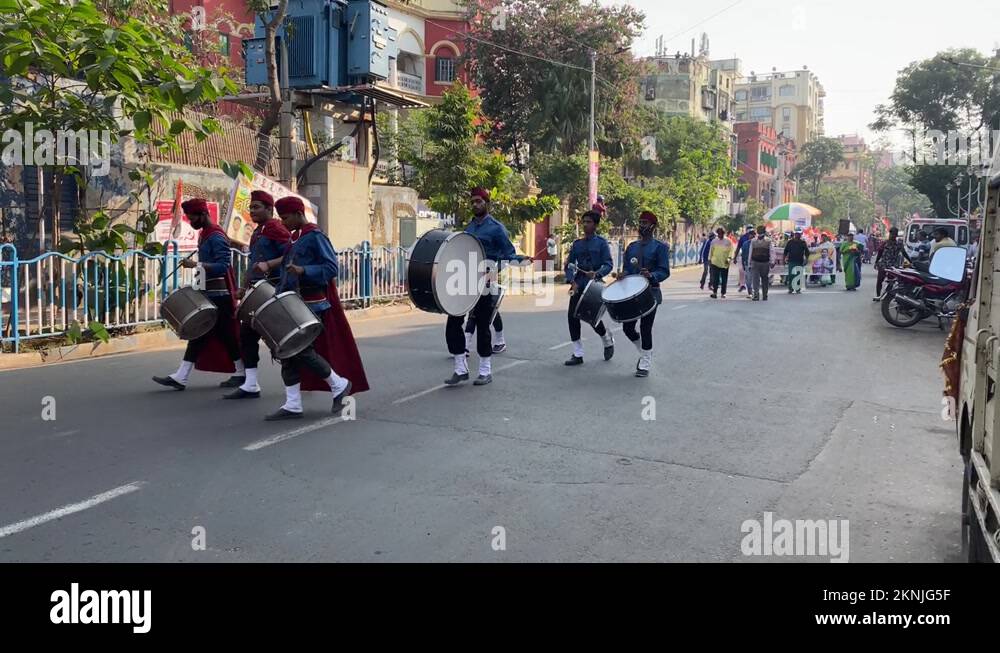 Static view of a youth band wearing blue costume and marching while ...