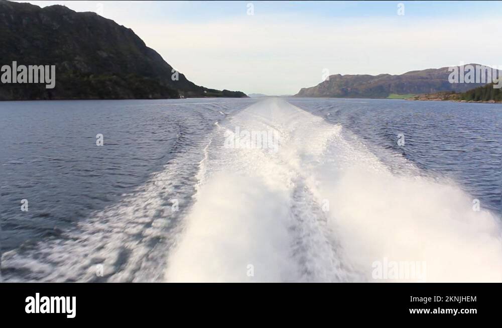Waves from the back of a speed boat over the water's surface in sea ...