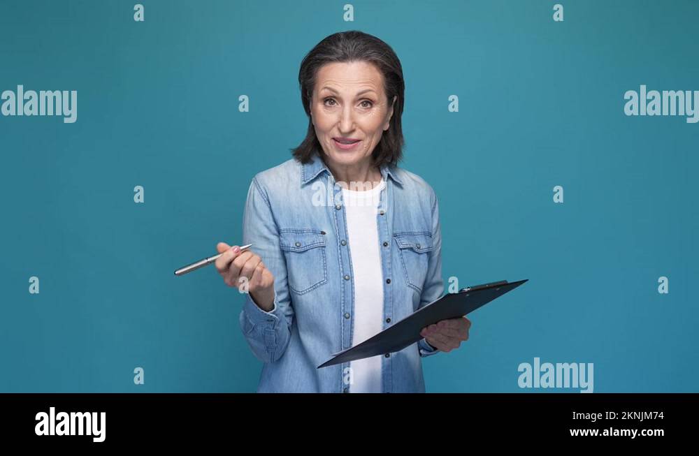 Lady secretary write document clip board isolated blue color background ...