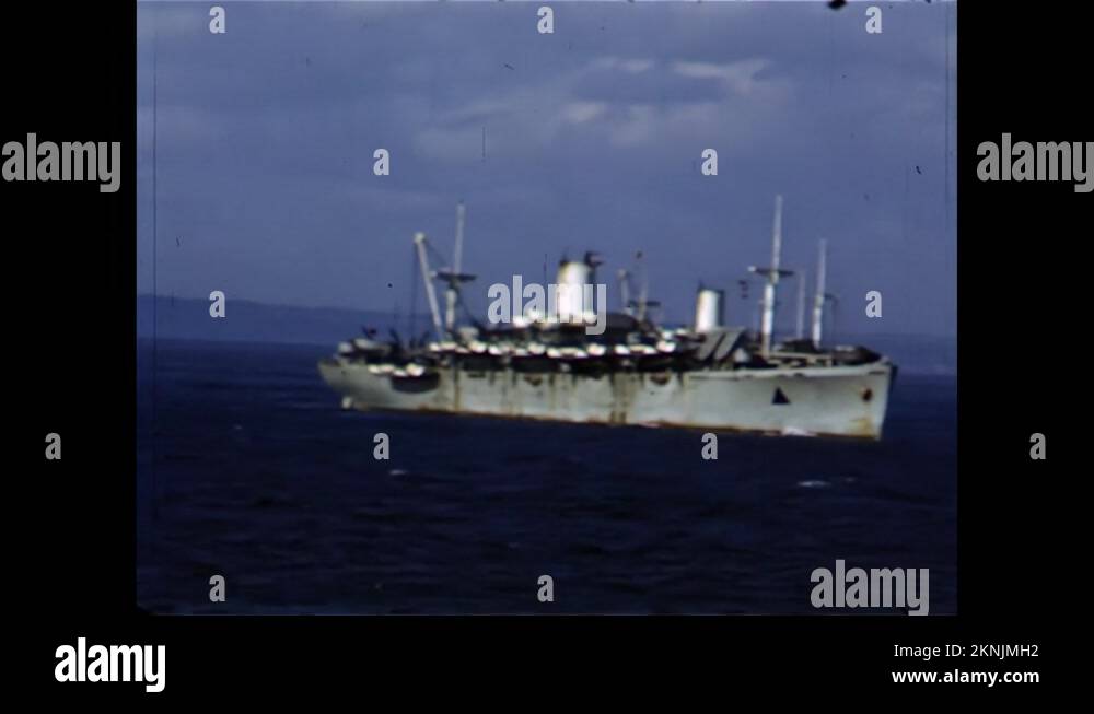 1940s: battleship at sea, two soldiers talking, soldiers walking along ...