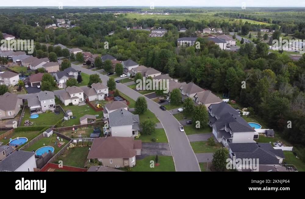 Drone flies upwards in an aerial of suburban development Stock Video ...