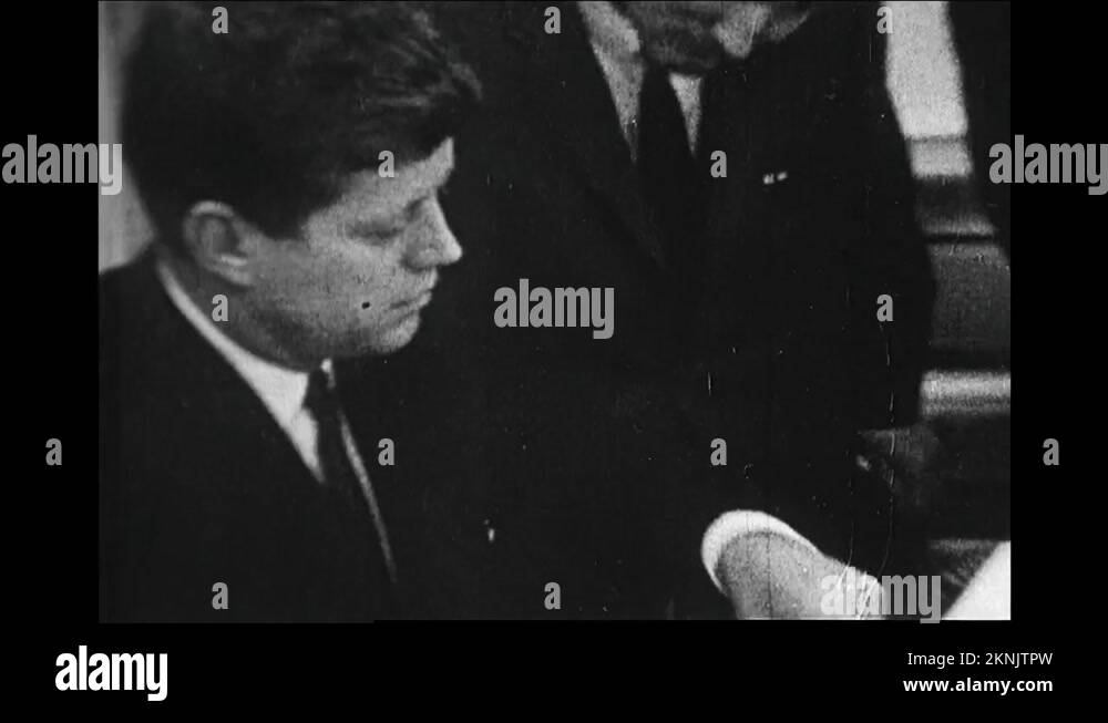 1960s: John F Kennedy at desk, zoom out to Kennedy with staff. Kennedy ...