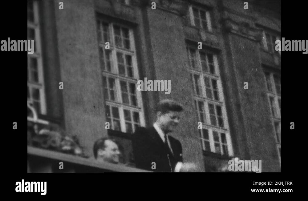 1960s: Low angle, John F Kennedy waving from stage. High angle ...