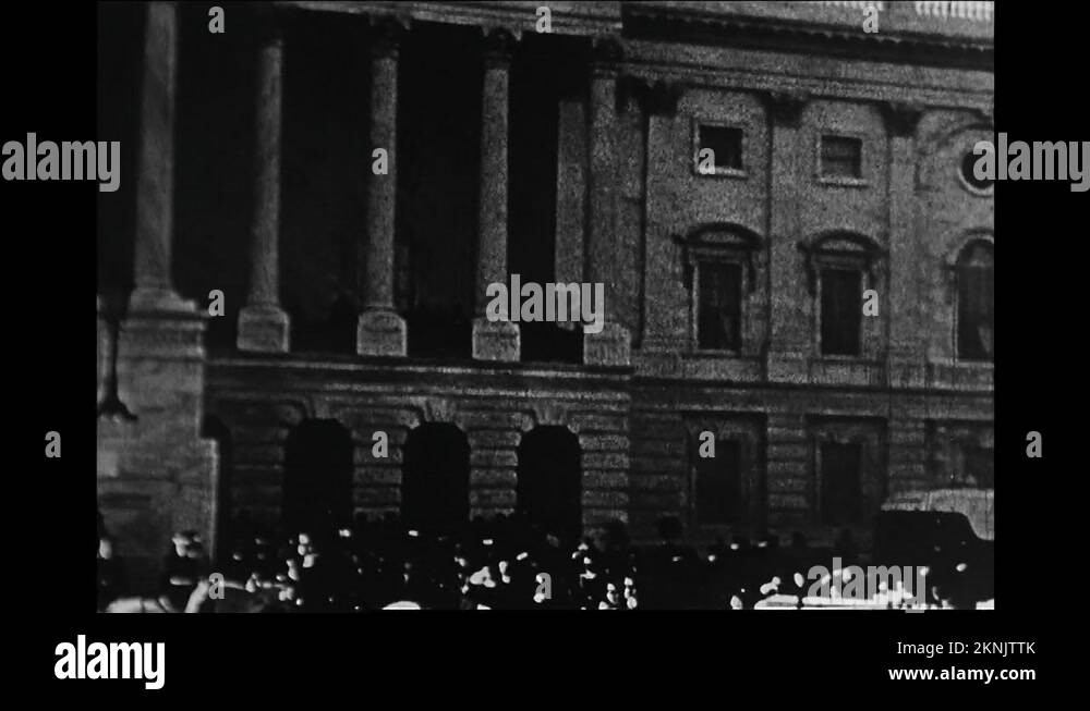1960s: Soldiers walking with coffin, tilt up to Capitol Building. Tilt ...