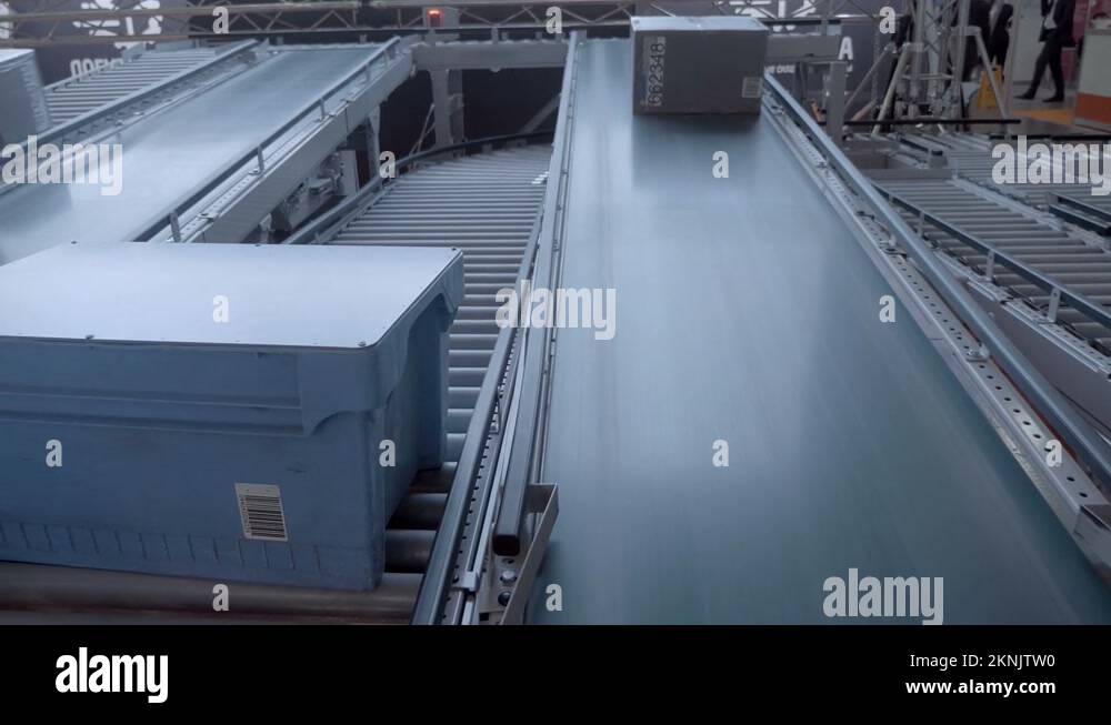 Belt conveyor and gravity roller conveyor is a transport line for ...