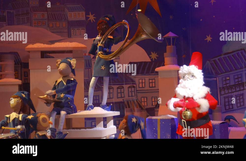 Elf dolls dancing in a Christmas window of Printemps Haussmann store in ...