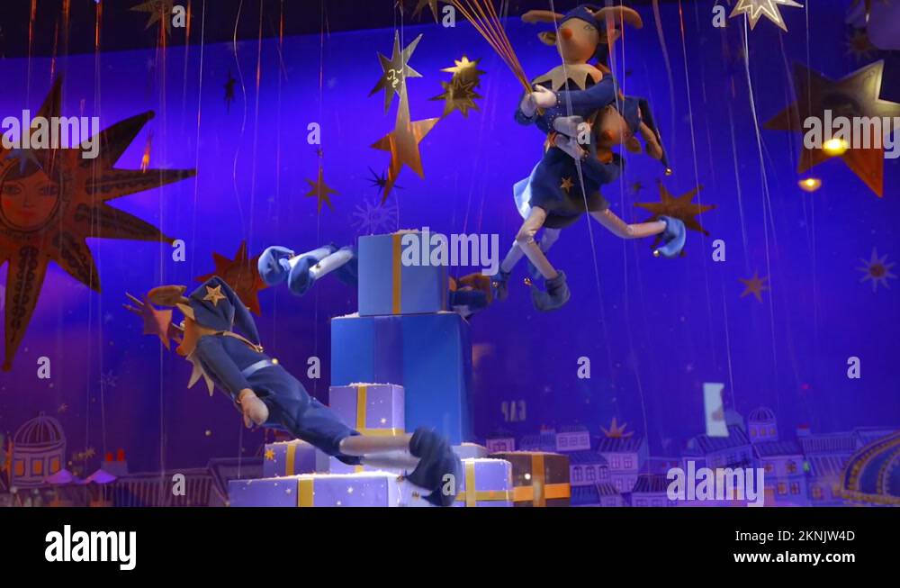 Elf dolls dancing in a Christmas window of Printemps Haussmann store in ...