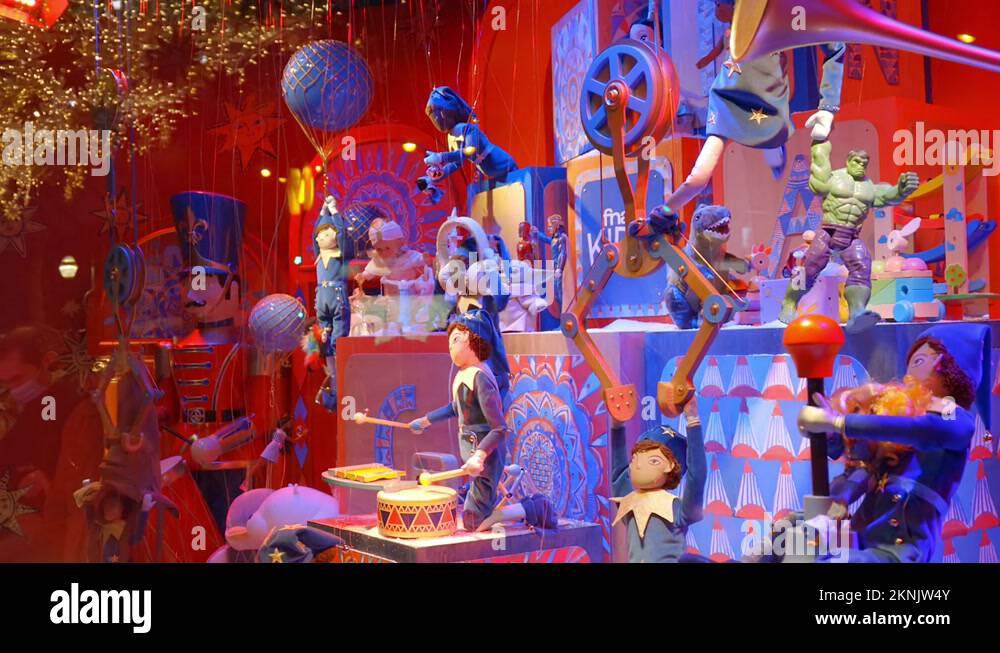 Elf puppets dancing in a Christmas window of Printemps Haussmann store ...