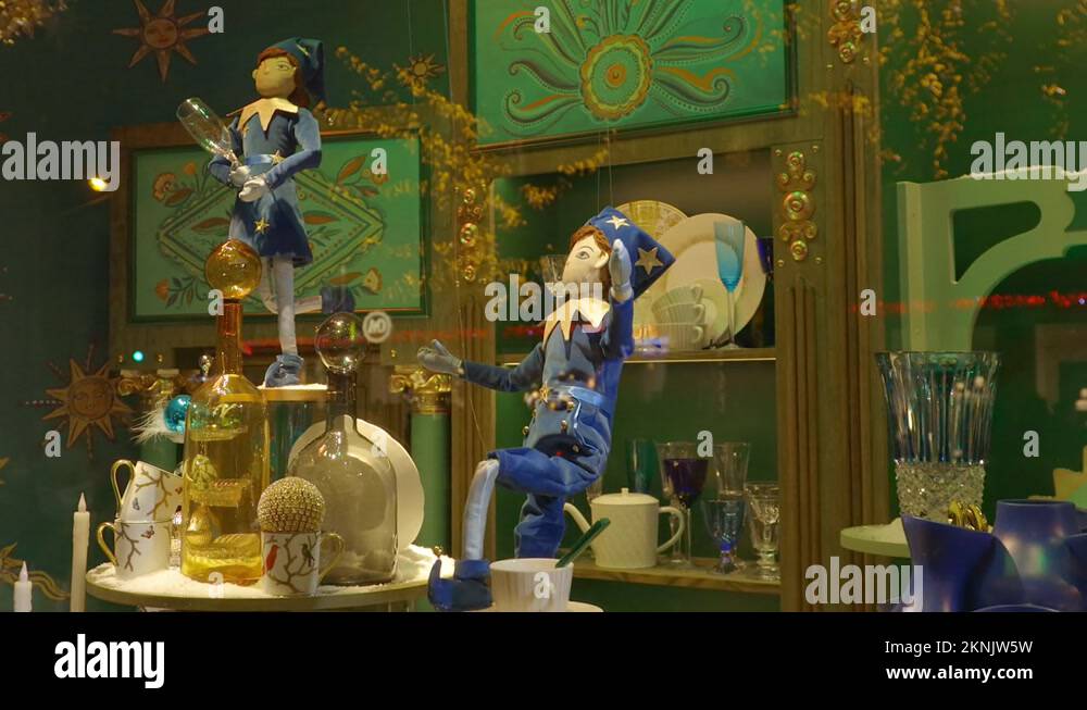 Elf dolls dancing in a Christmas window of Printemps Haussmann store in ...