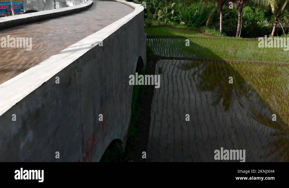 Buk Renteng irrigation water channel aerial footage from drone flying ...