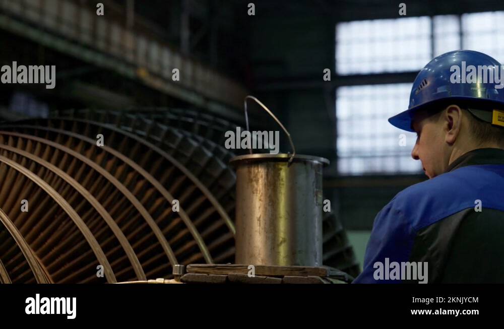 Industrial Worker Inspection Of Turbine Working on testing stand at ...