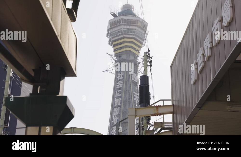 Streets of Osaka Japan, Tilt Up Reveal of Shin-Sekai Tower in Morning ...