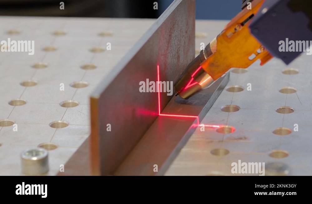 Industrial welding robotic arm scanning metal workpiece with laser ...