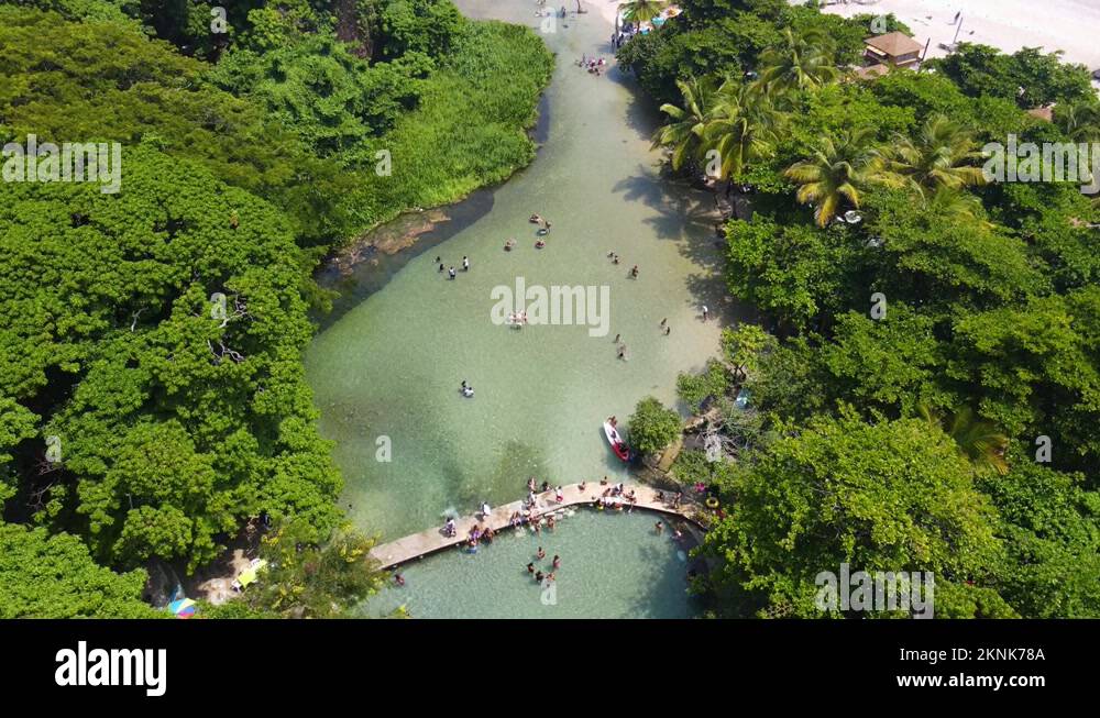 River that flows into a beach, Los Patos, Barahona, Dominican Republic ...