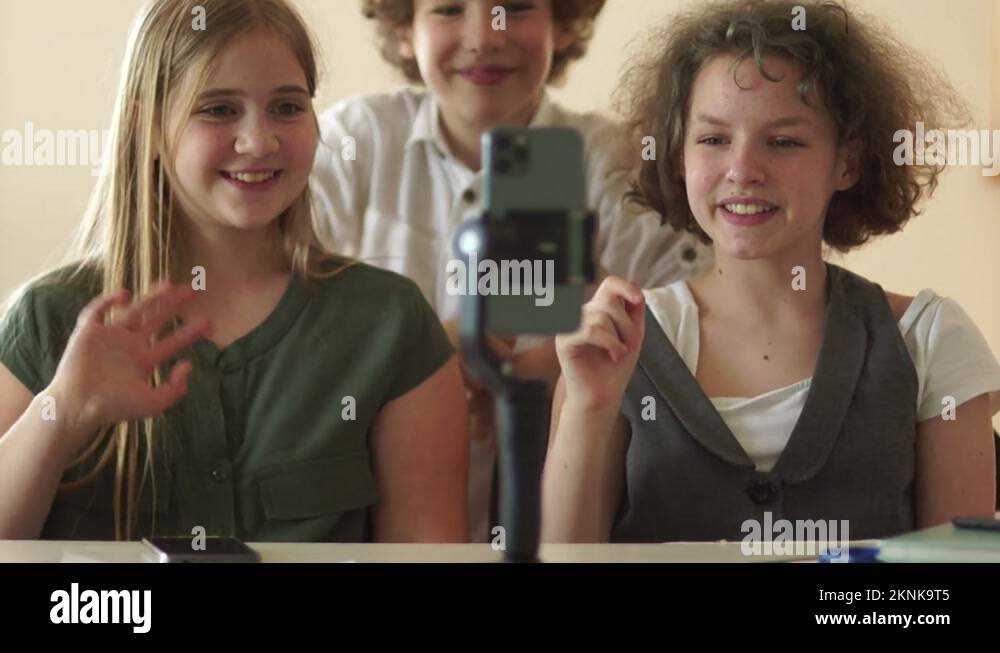 Three funny classmates high school students having fun video calls ...