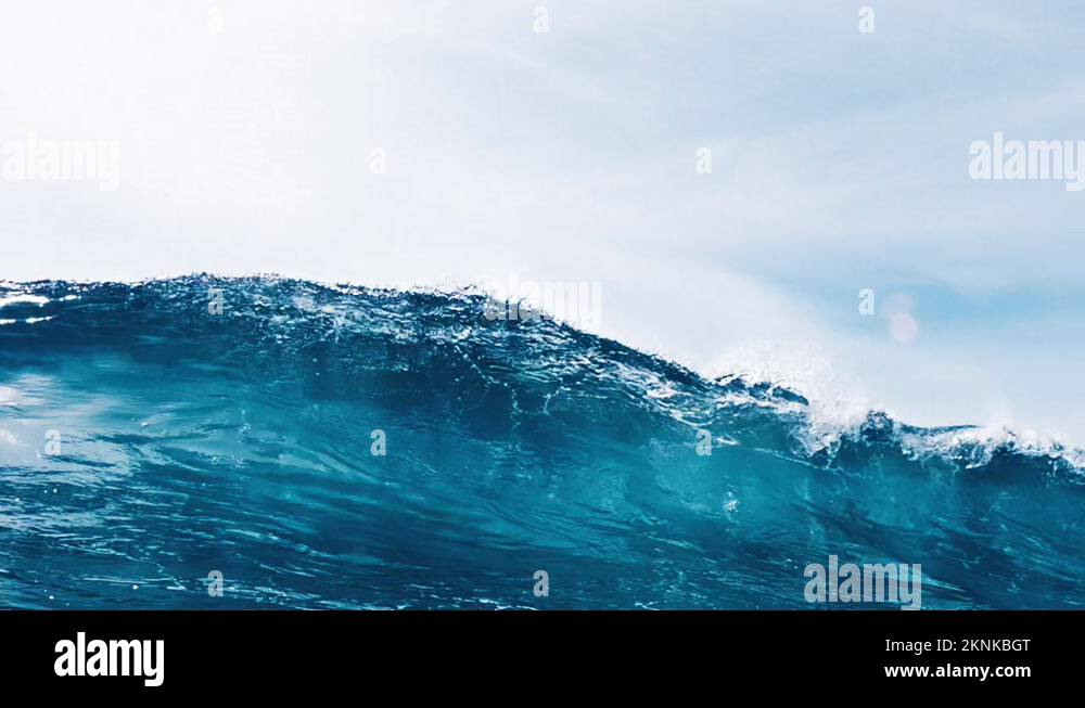 Ocean wave. Powerful clear ocean wave rolls and breaks on the surf spot ...