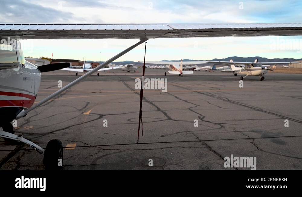 Cessna 182 airplane wing at Colorado metro airport with planes on ...