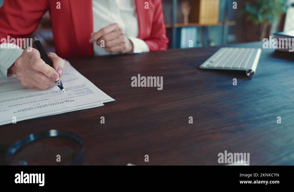 Lady hr using gadget prepare report write paper sit desk in workplace ...