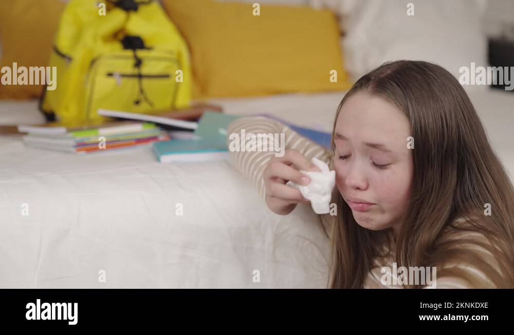 teenager girl crying sitting on floor, trouble with homework, child is ...