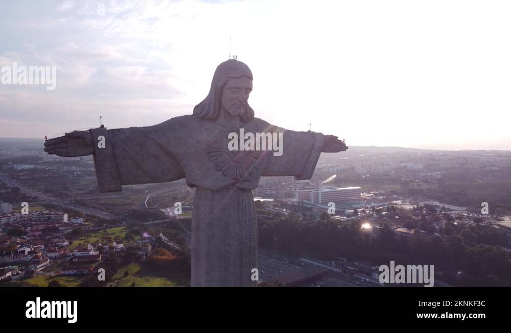 Drone slowly descending with Statue Cristo Rei of Jesus Christ in front ...