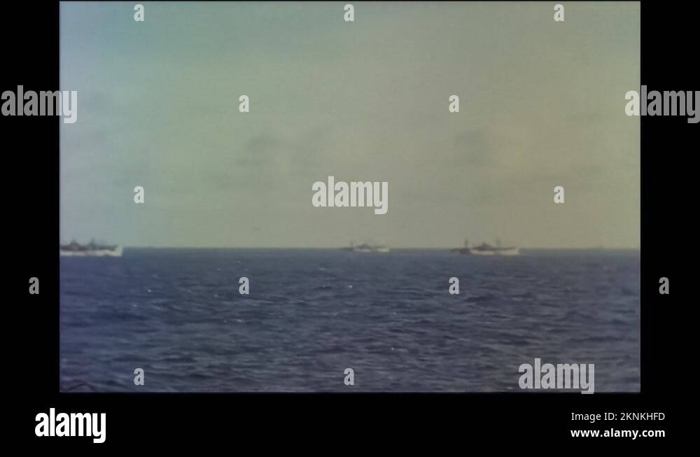 1940s: Naval ships in the Pacific Ocean. A rainbow near a ship Stock ...