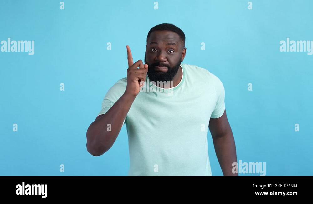 Aggressive guy finger mouth not be noisy child isolated blue color ...