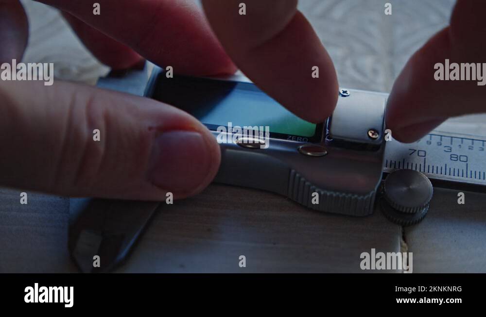 Measuring metal piece with vernier caliper Stock Video Footage - Alamy
