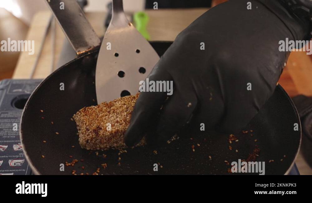 Chef hands using spatula to lift up and transfer a perfect cooked ...