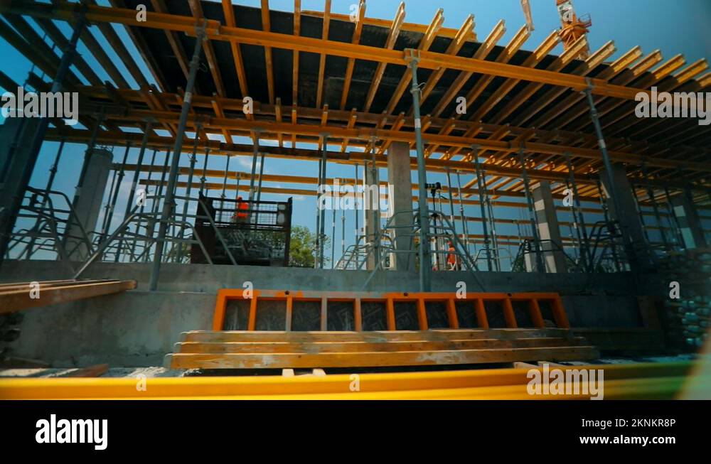 Working process at a construction site. Workers make a reinforced ...