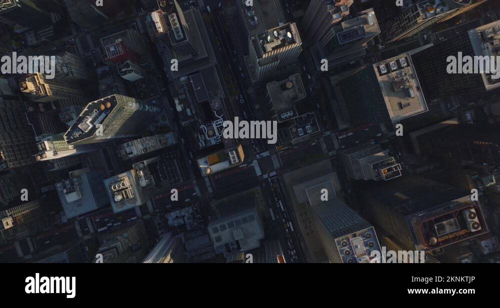 Aerial birds eye overhead top down panning view of tall buildings in ...