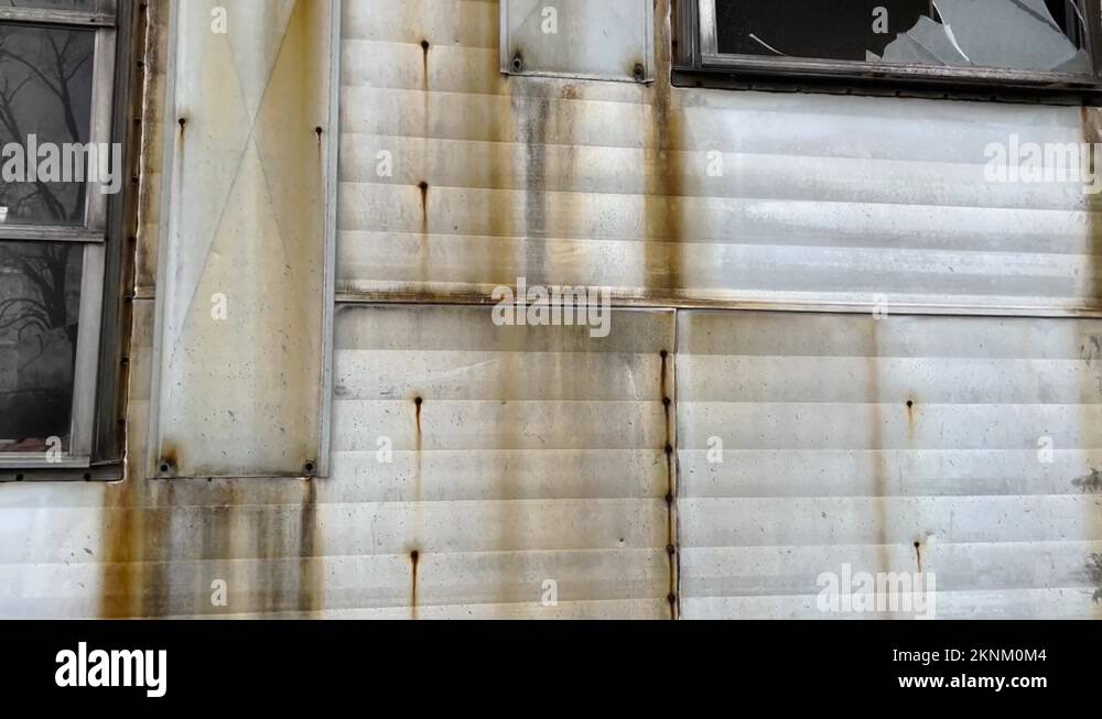 Abandoned rusted creepy mobile home with busted out windows Stock Video ...