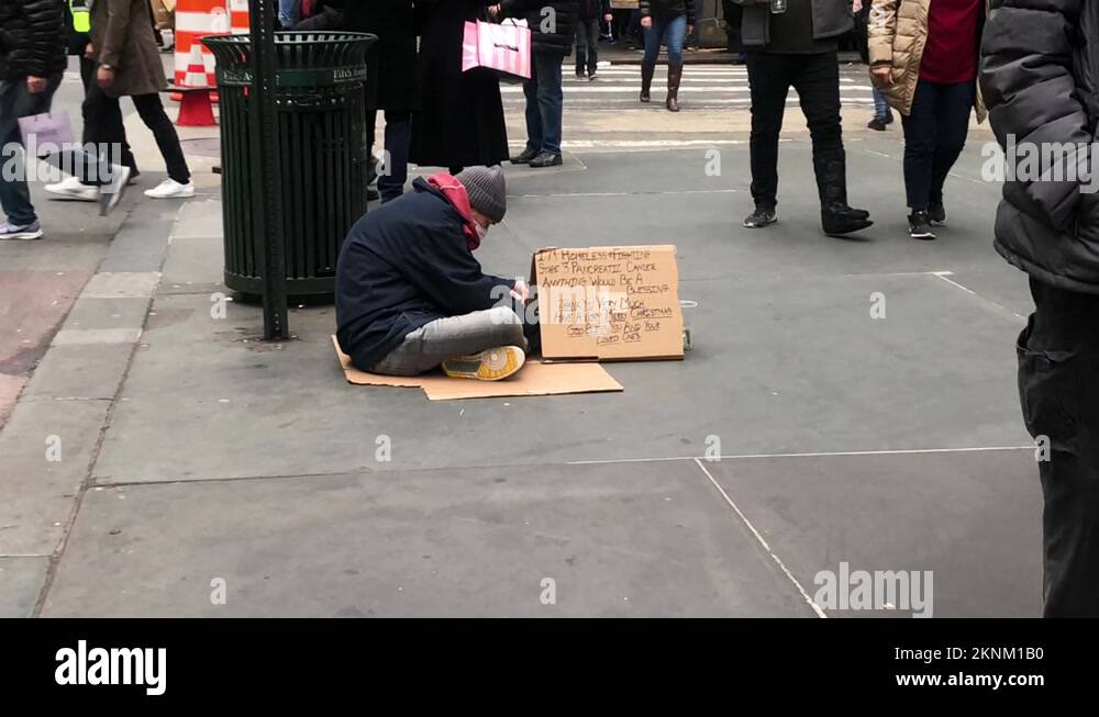 Sitting beggar Stock Videos & Footage - HD and 4K Video Clips - Alamy