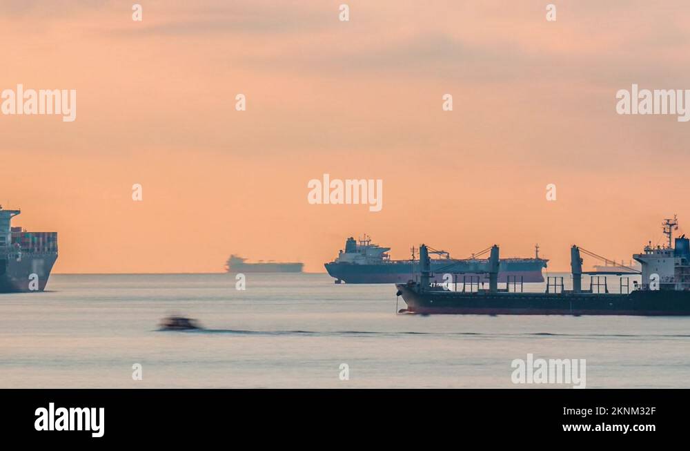 Early morning scene of cargo ships and tankers anchored off of ...