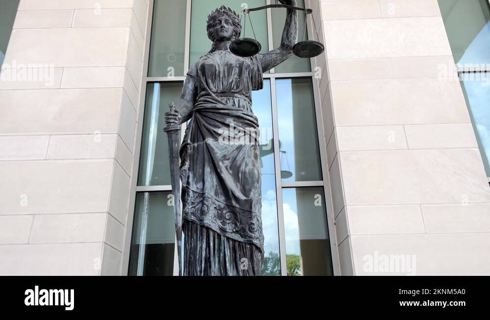 Tilt of Lady Justice statute in from of the Richmond County courthouse ...