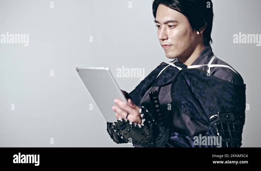 Japanese Samurai using a tablet PC. Japanese traditional warrior Stock Video Footage - Alamy