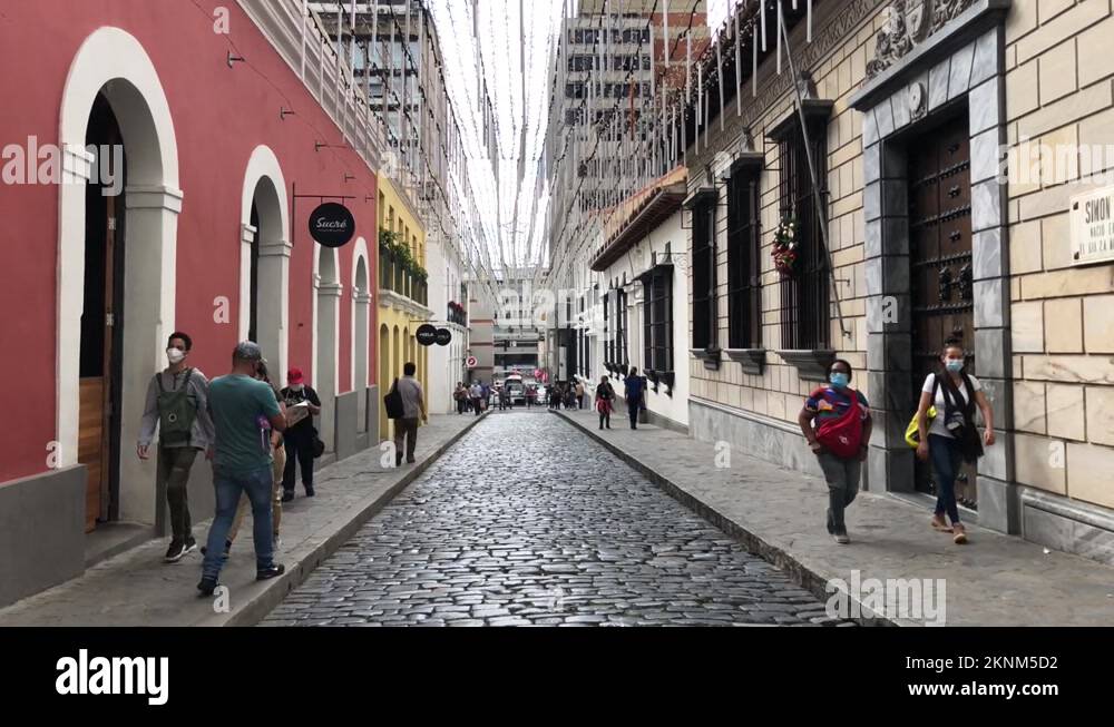 People walking along historic centre streets in downtown Caracas city ...