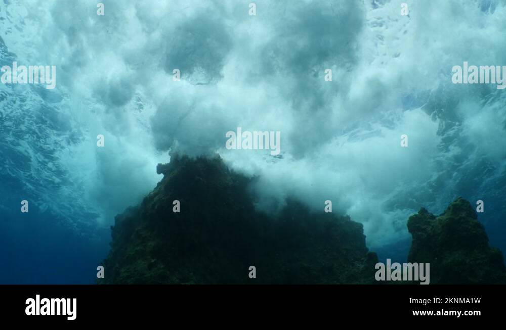 choppy underwater wave rocks foam on the surface ocean scenery ...