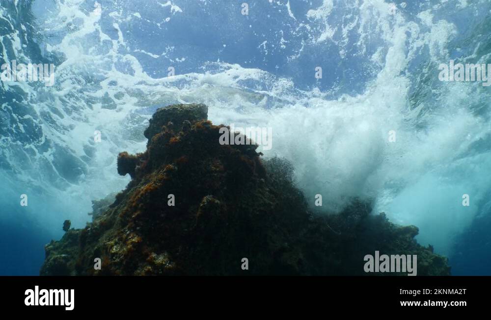 choppy underwater wave rocks foam on the surface ocean scenery ...
