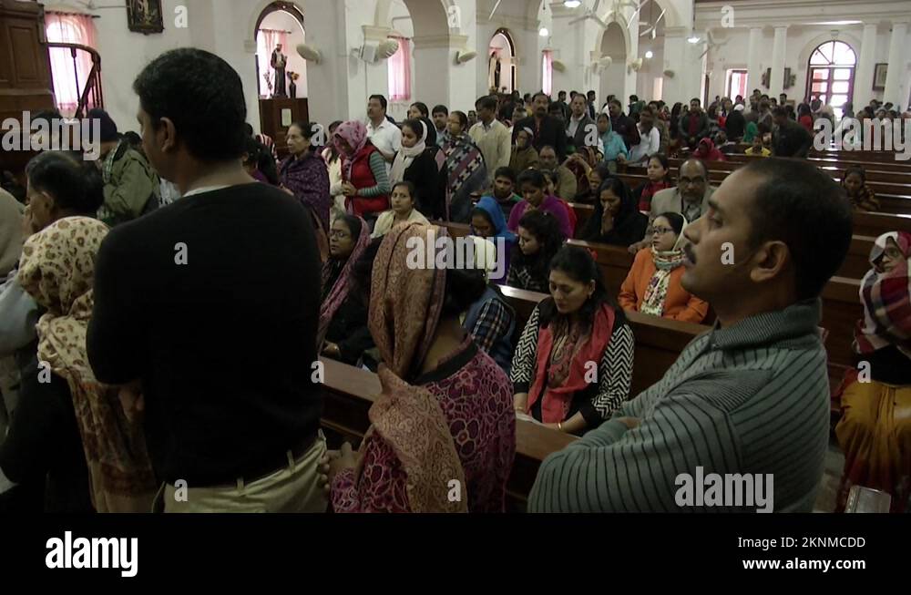 Indian Christian crowded mass church, queue of devotees taking the Holy ...