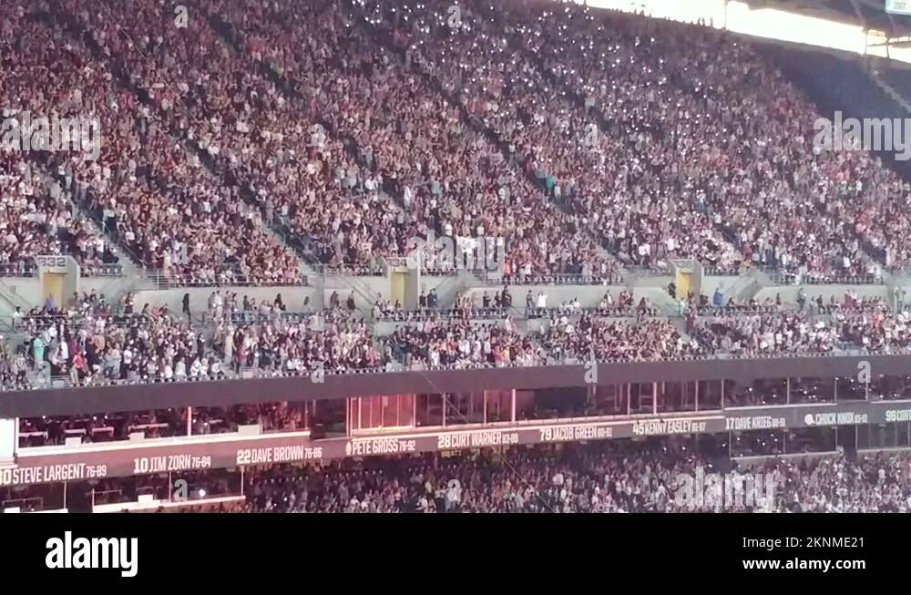 Huge Crowd Of Fans Dancing In The Audience Area Of A Stadium While ...