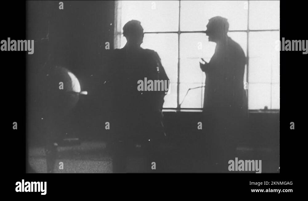 1940s: Hitler and government official talk in office. German official ...