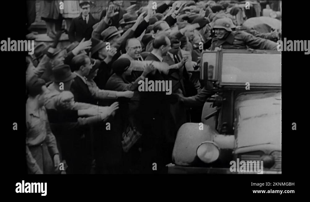 1940s: German soldiers shake hands and wave from back of trucks and ...