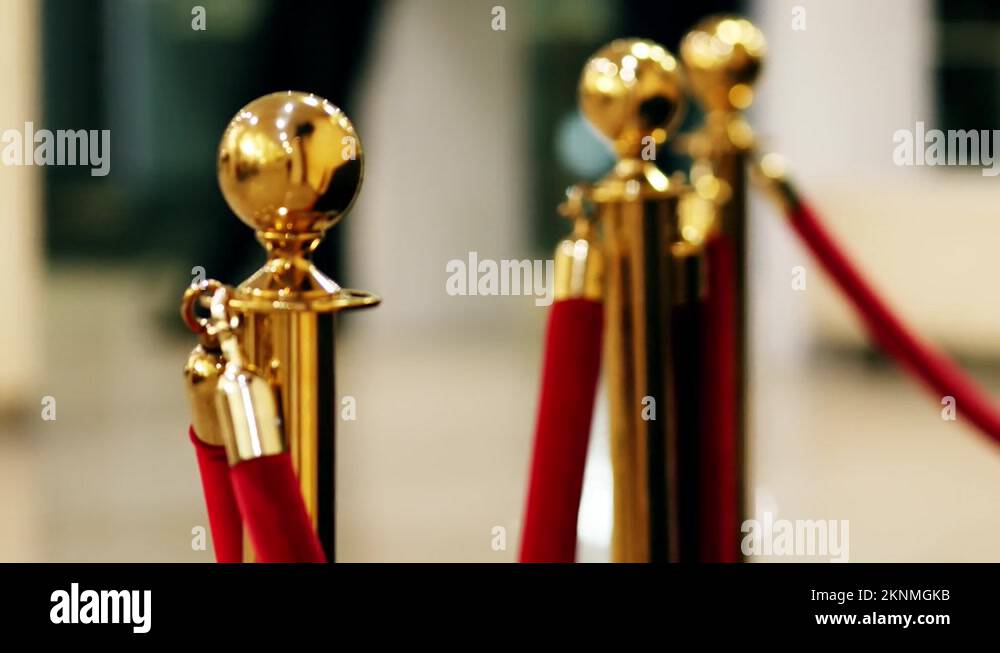 Velvet red luxury ropes closed at valuable exhibit in museum or vip ...