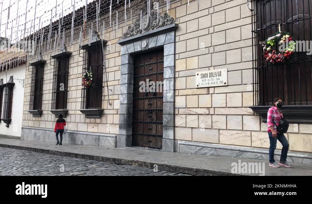 People walking along historic centre streets in downtown Caracas city ...