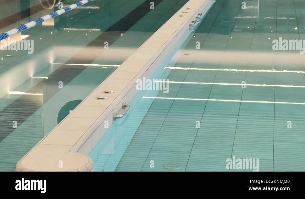 Clean pool in the fitness club. Empty tracks. Swimming pool with water ...