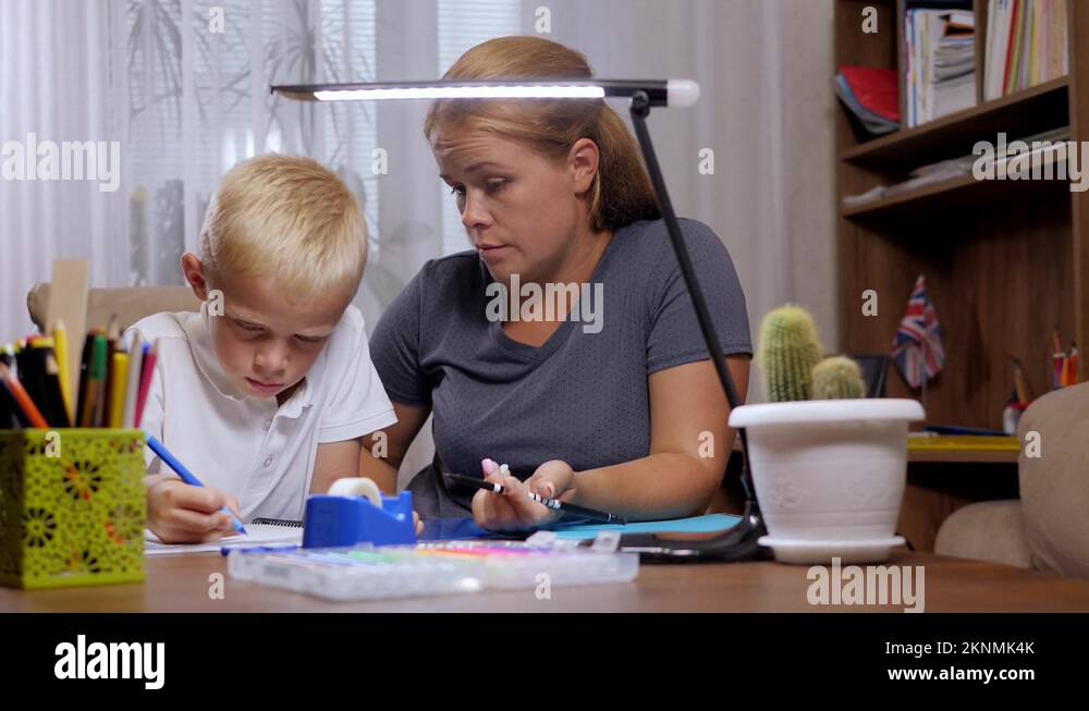 An angry mother scolds her son for a mistake in homework Stock Video ...