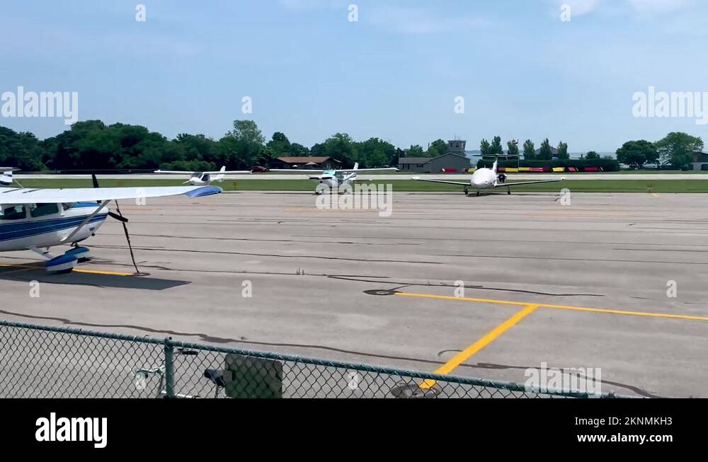 Put In Bay Airport. Airplanes parked on the side of the runway Stock ...