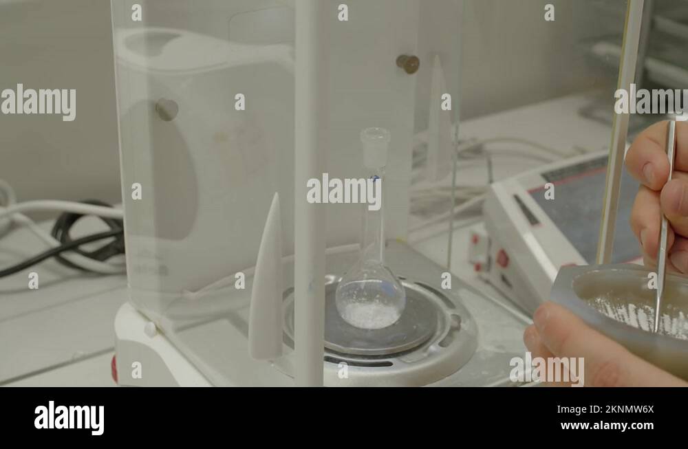 Measuring drug weight, scale with laboratory glassware or test tube ...
