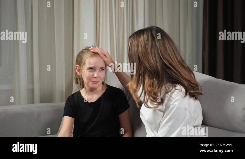 Teen girl complains crying while mother calms daughter Stock Video ...