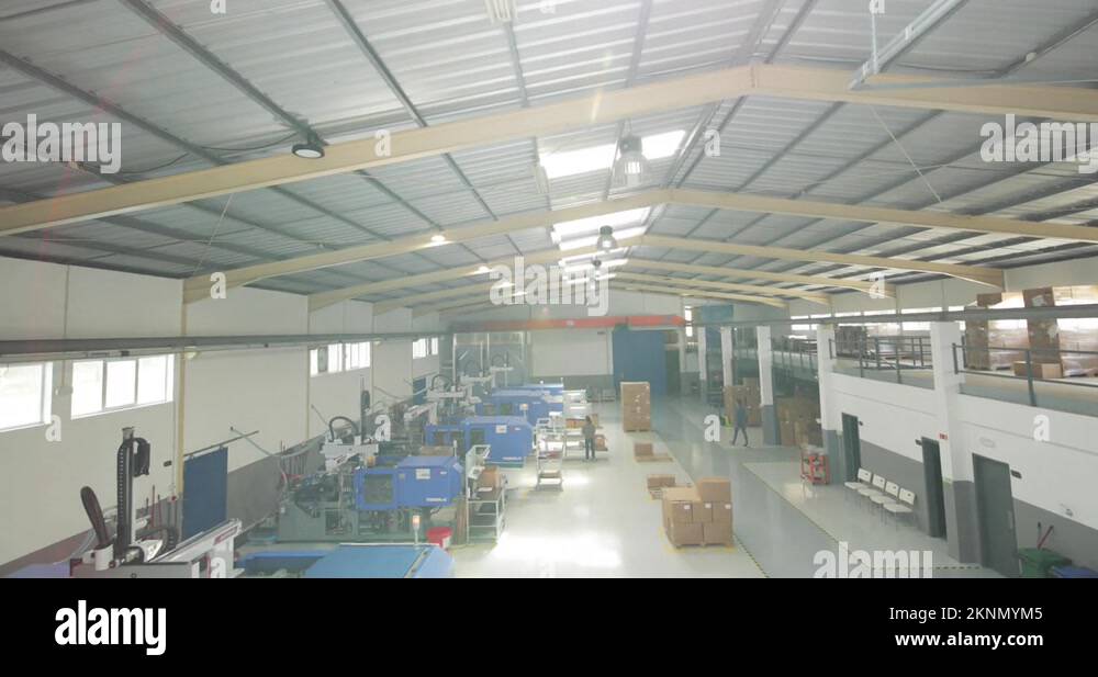 Modern Machinery And Workers In An Injection Molding Manufacturing ...